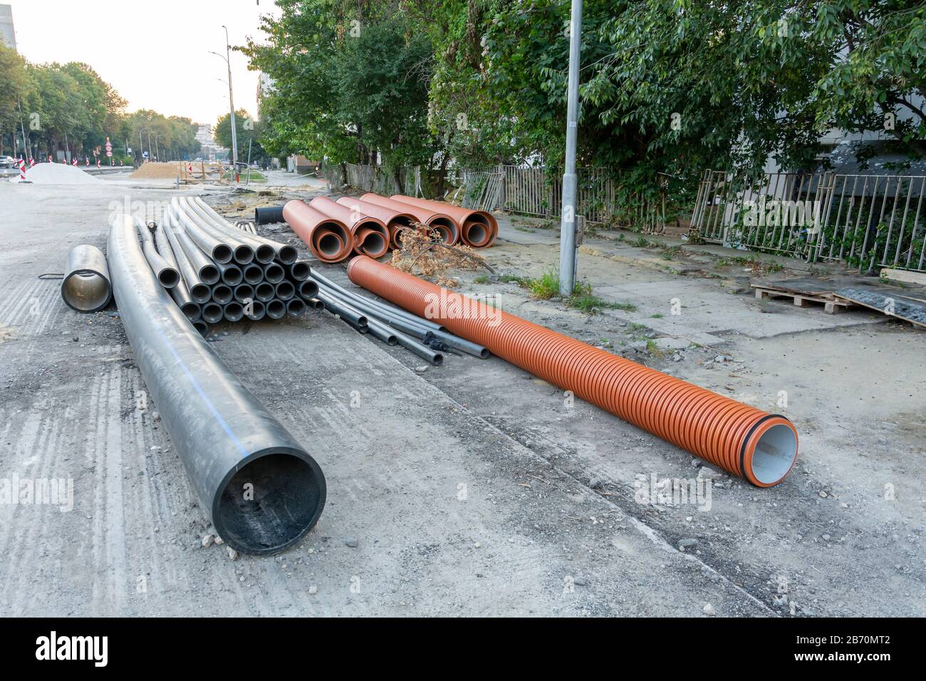 Pvc Pipeline stacked on the road, road construction with pipes Stock ...
