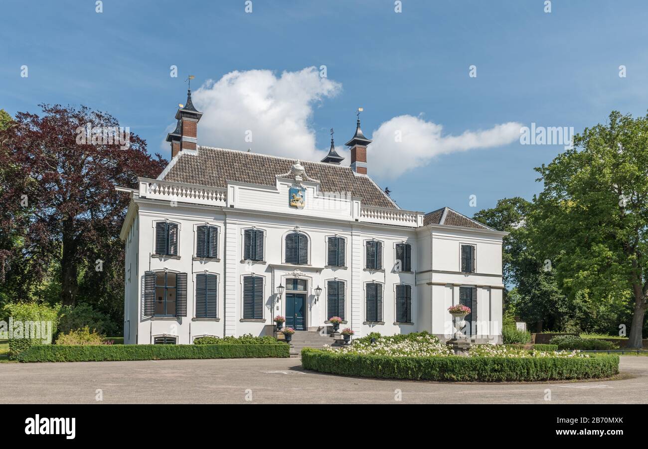 Historic Dutch mansion surrounded by trees and with a blue sky Stock ...