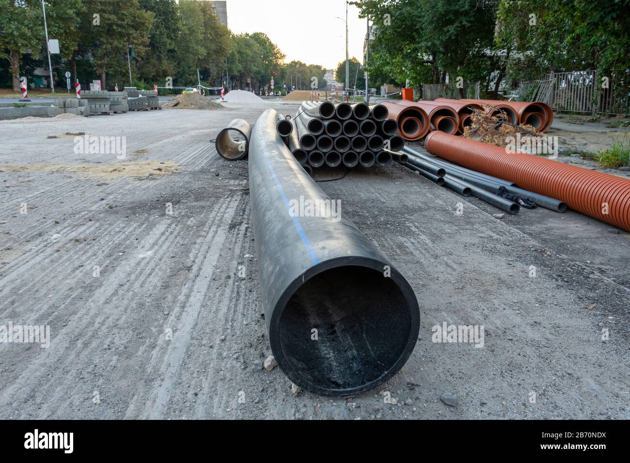Pvc Pipeline stacked on the road, road construction with pipes Stock ...