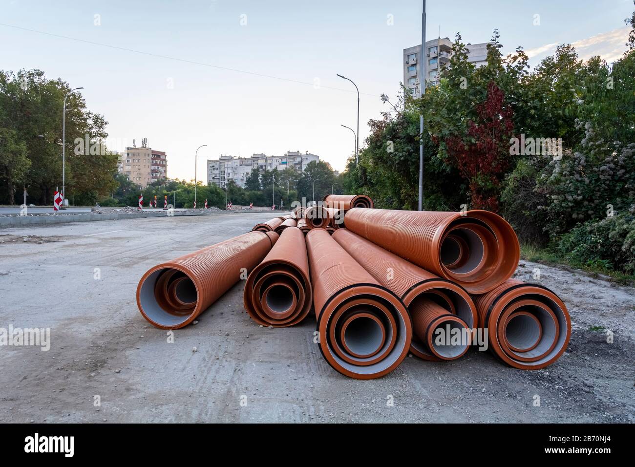 Pvc Pipeline stacked on the road, road construction with pipes Stock ...