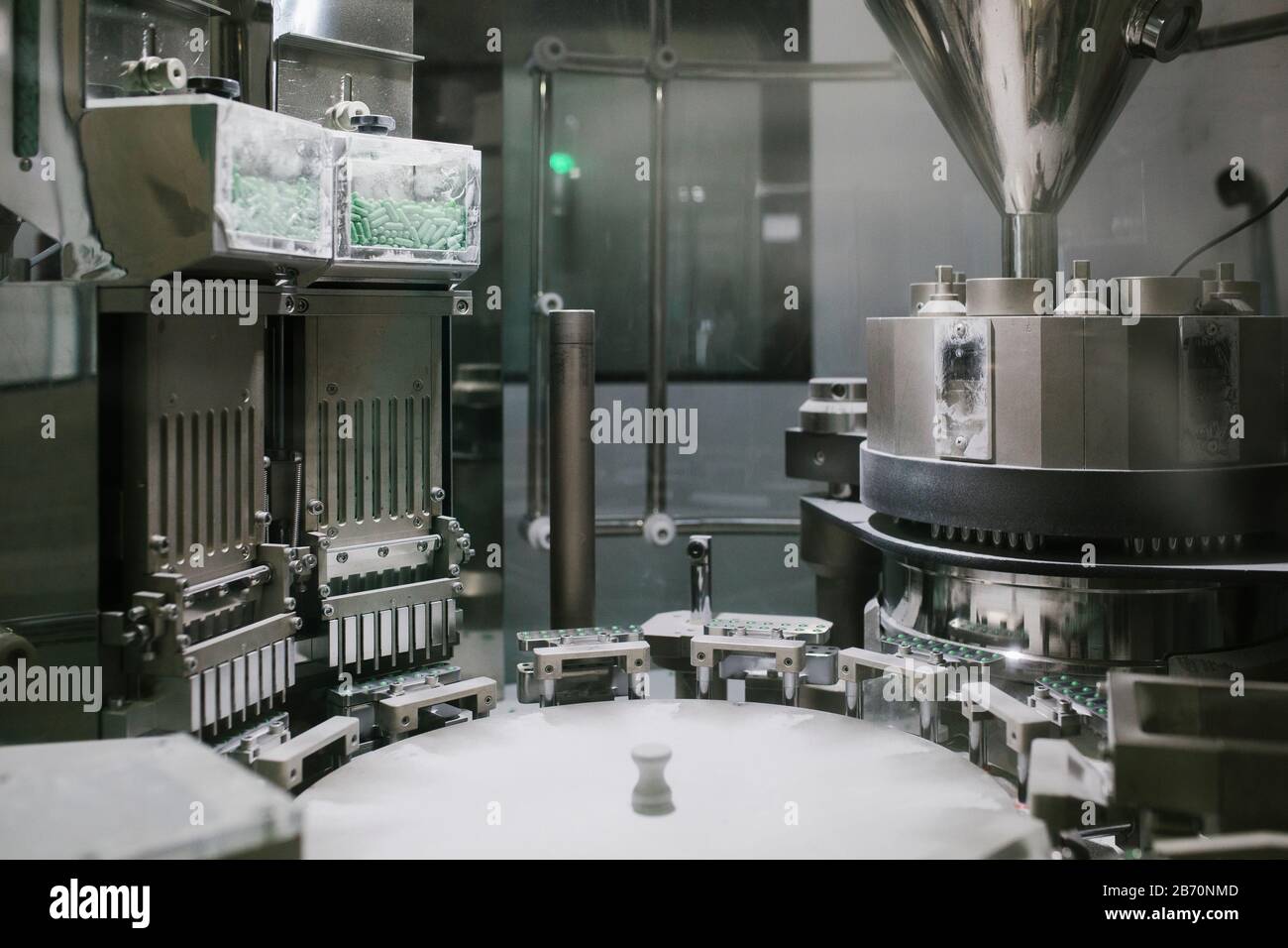 Machine making pills in a pharmaceutical factory Stock Photo - Alamy