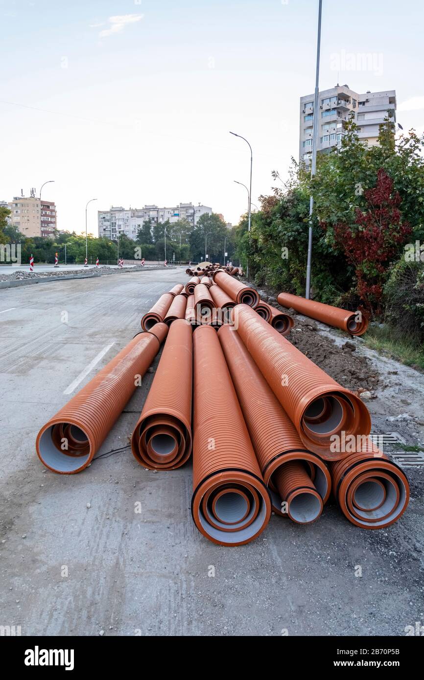 Pvc Pipeline stacked on the road, road construction with pipes Stock ...