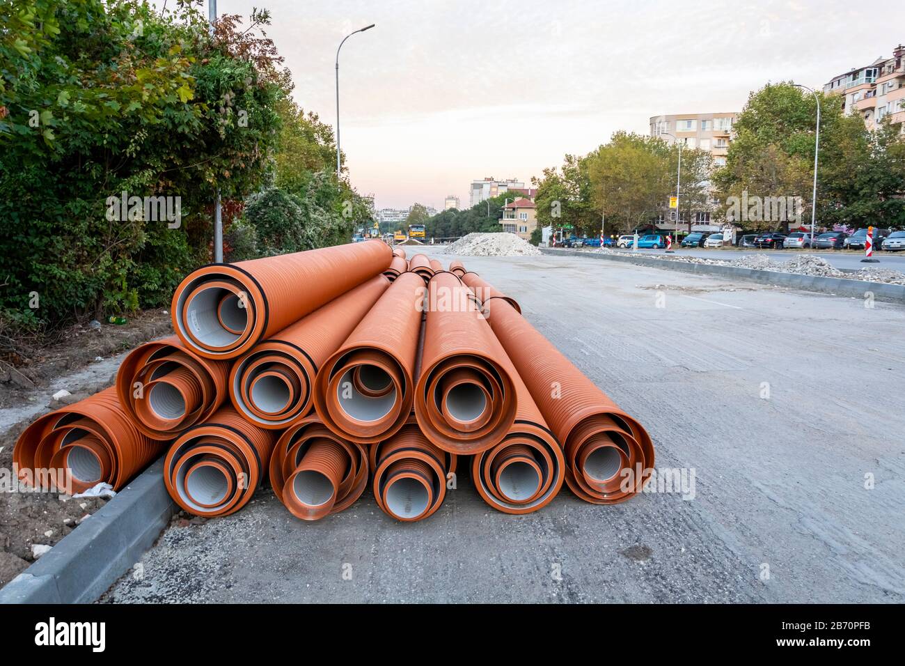 Pvc Pipeline stacked on the road, road construction with pipes Stock ...