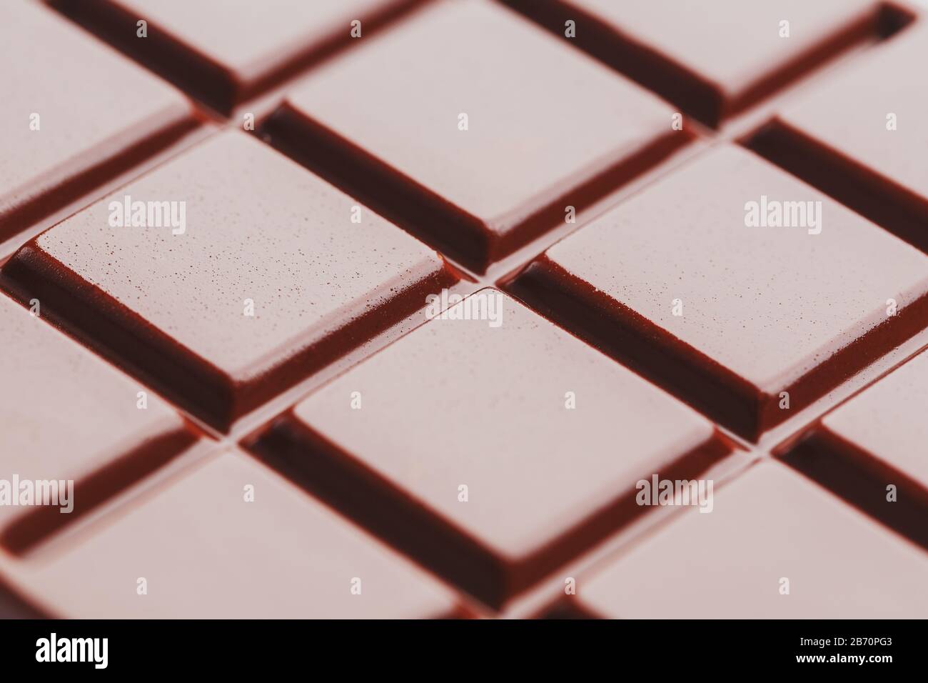Milk chocolate close up. Segments of chocolate in the macro. Full frame ...