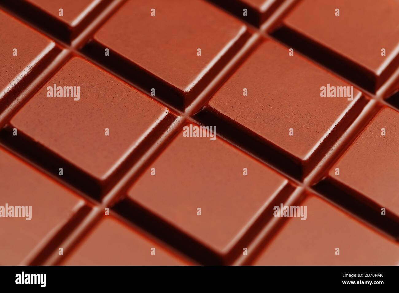 Texture of dark chocolate close up. Segments of a chocolate bar in ...