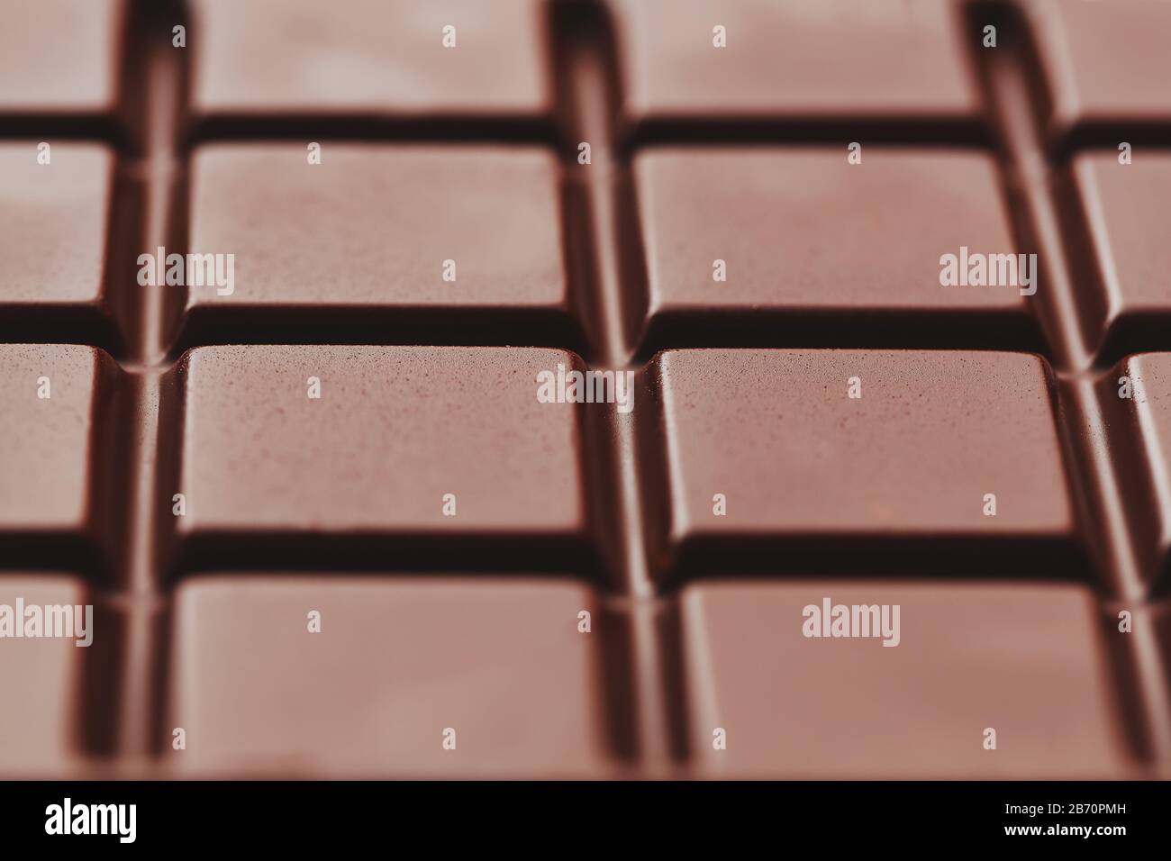 Texture of dark chocolate close up. Segments of a chocolate bar in ...