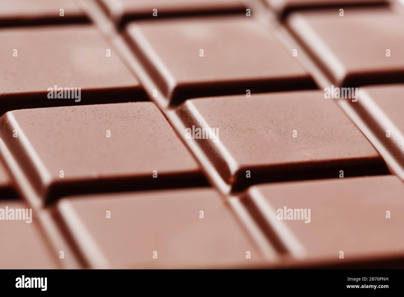 Texture of dark chocolate close up. Segments of a chocolate bar in ...