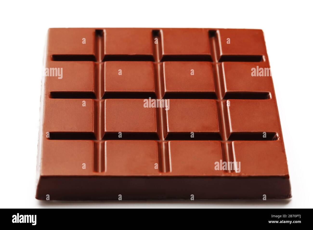 Square-shaped milk chocolate on a white background from above. Isolated ...