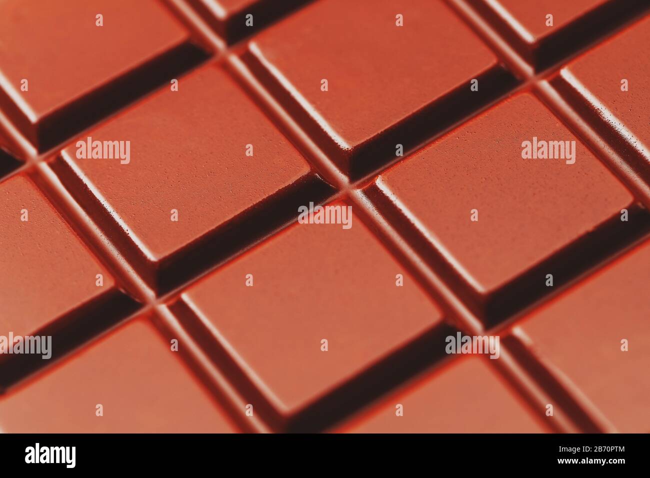 Texture of dark chocolate close up. Segments of a chocolate bar in ...