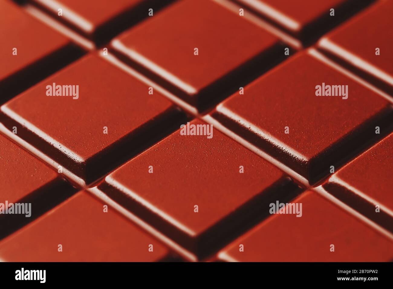 Texture of dark chocolate close up. Segments of a chocolate bar in ...