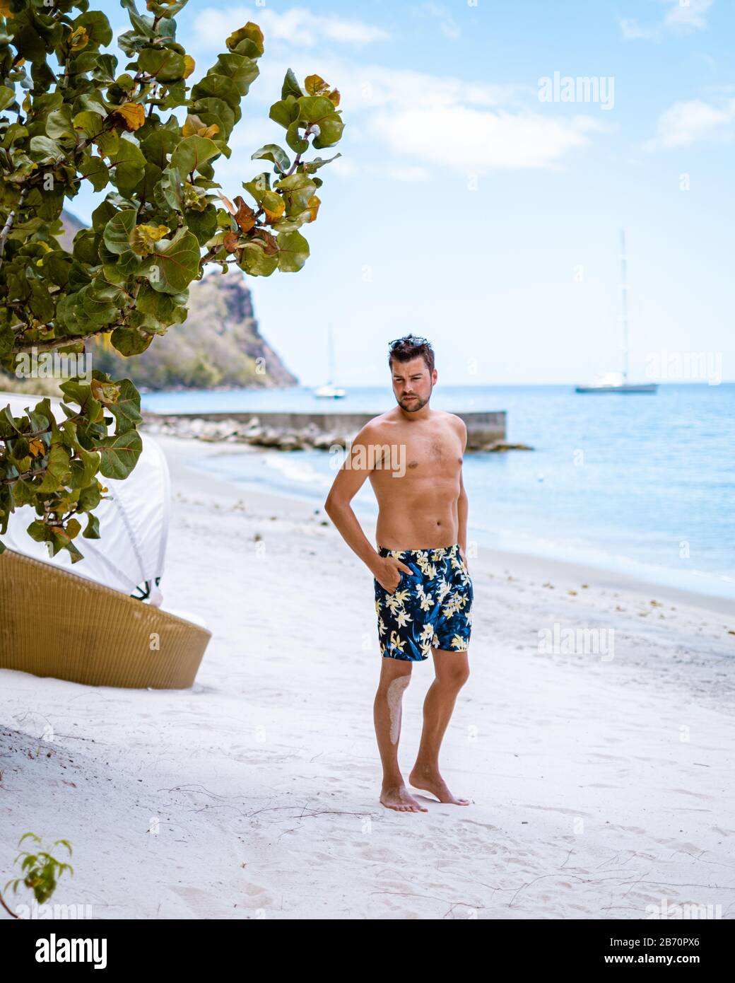 young men in swimshort, Sugar beach Saint Lucia , a public white ...