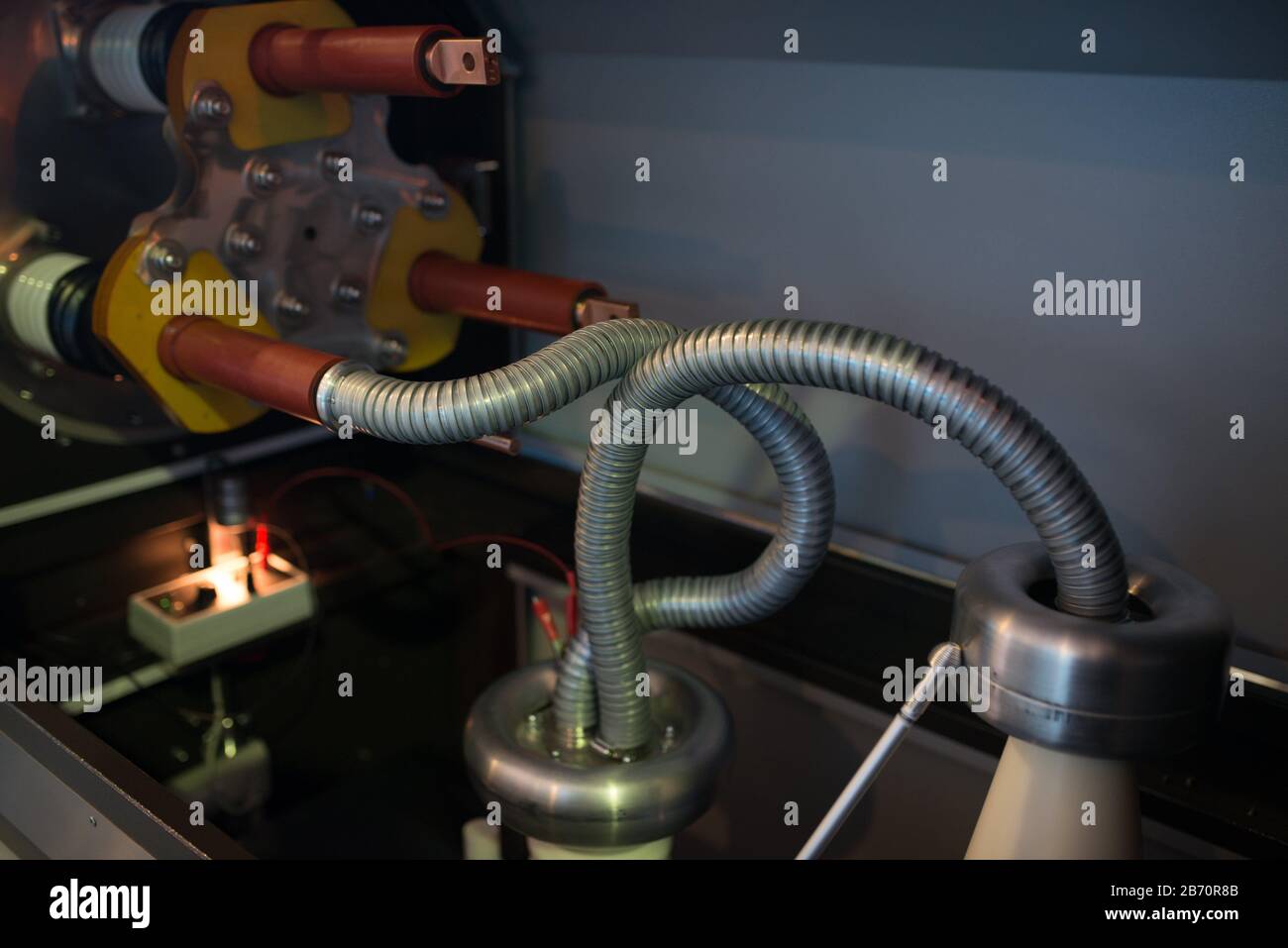 Three copper high voltage terminals with ceramic cylinders and ...