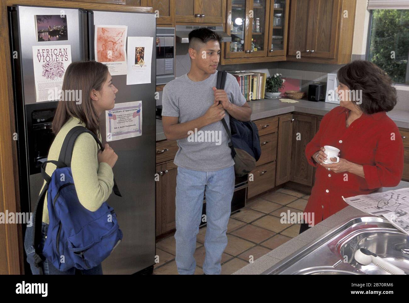 Austin Texas USA, 2000: Hispanic teens talking to their mom before ...