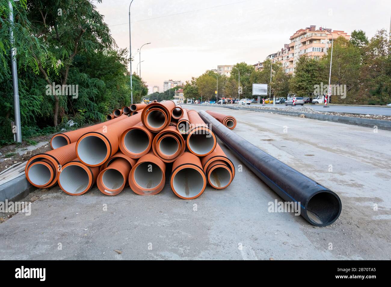 Pvc Pipeline stacked on the road, road construction with pipes Stock ...