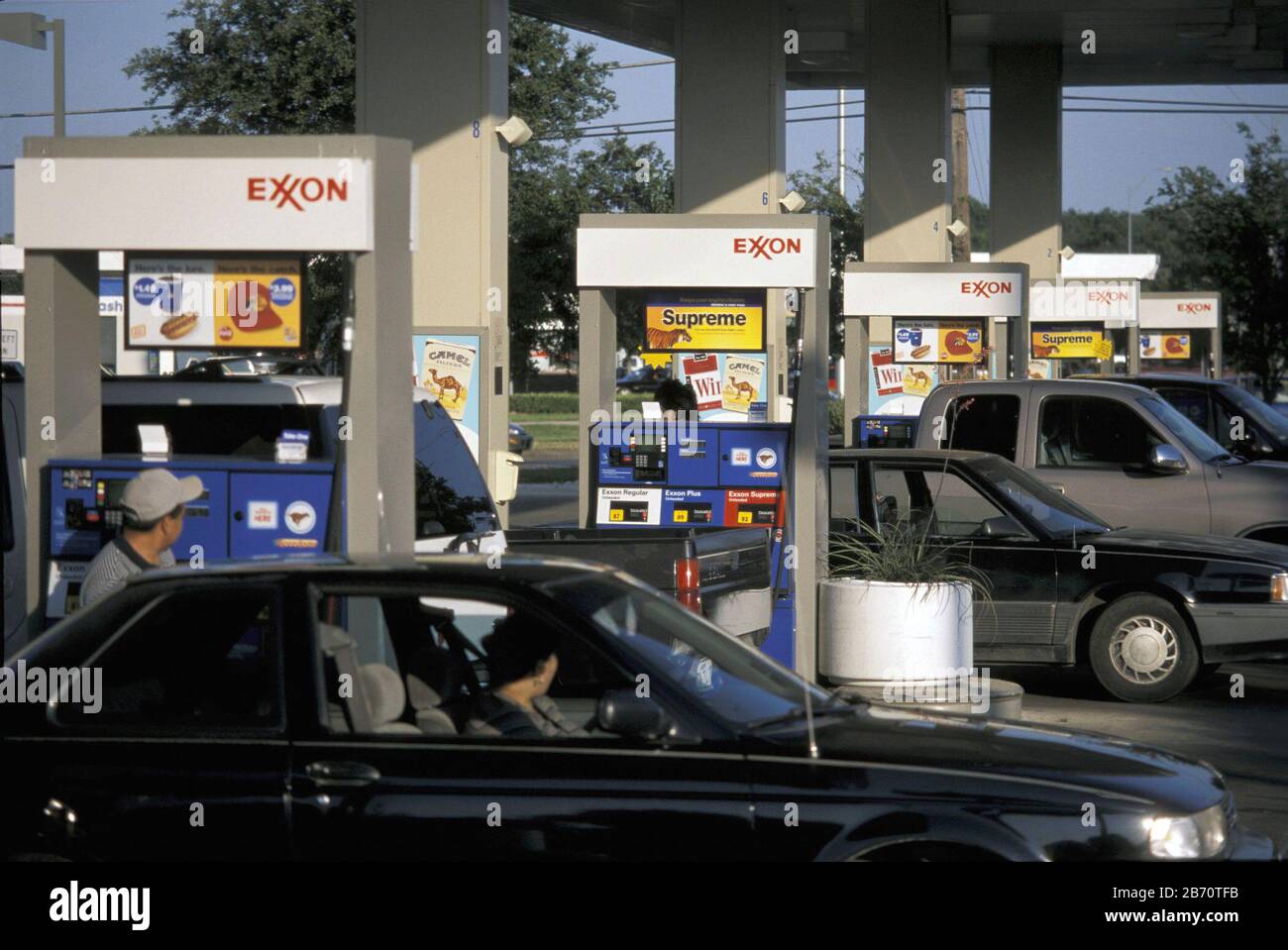 Austin Texas USA, April 2001: Drivers filling vehicles with gas at self ...