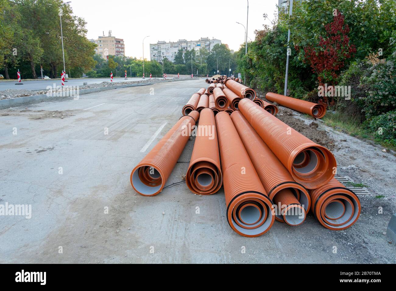 Pvc Pipeline stacked on the road, road construction with pipes Stock ...