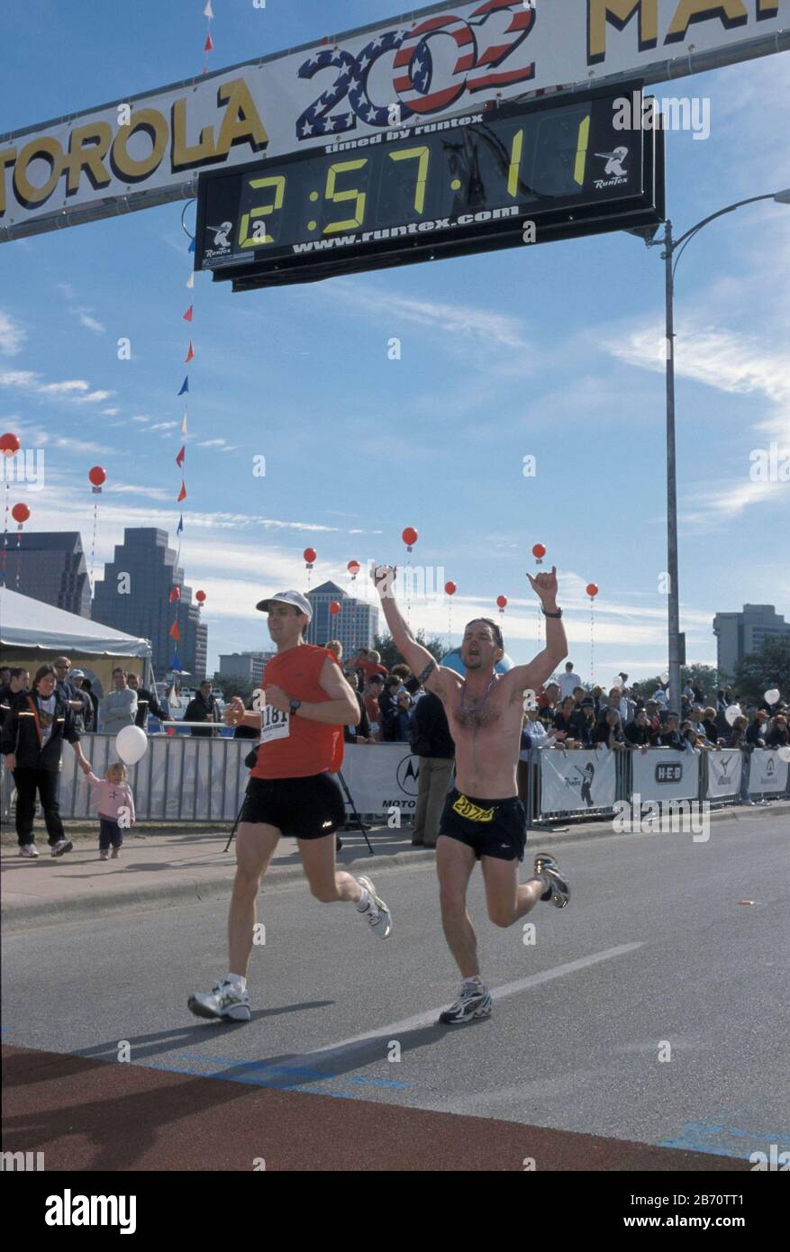 Austin, Texas USA, 2002: Men crossing finish line of Motorola Marathon ...