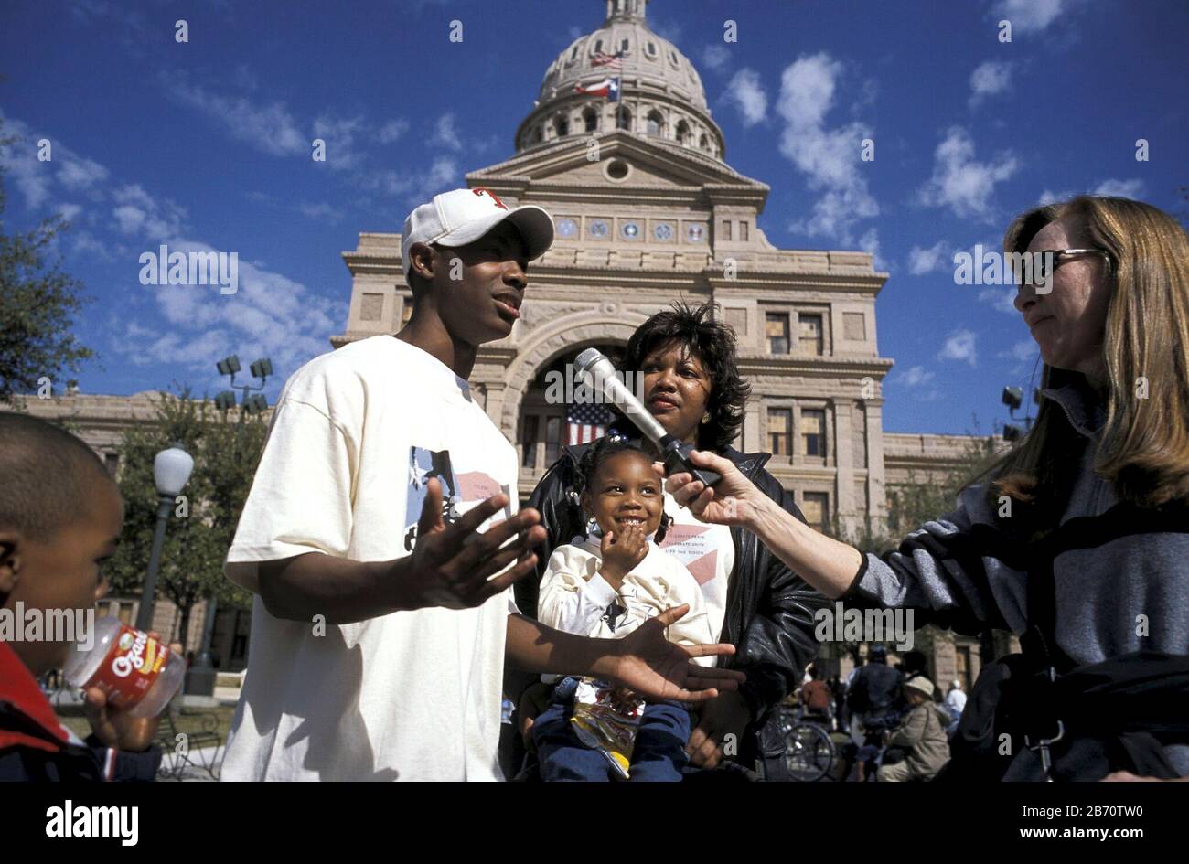 Austin Texas USA, February 2002 : Reporter interviews young man during ...