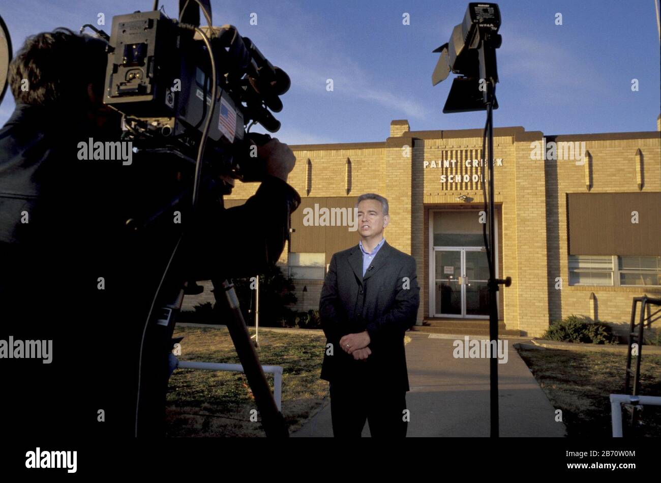 Paint Creek Texas USA: News reporter Wayne Slater speaks for a TV ...