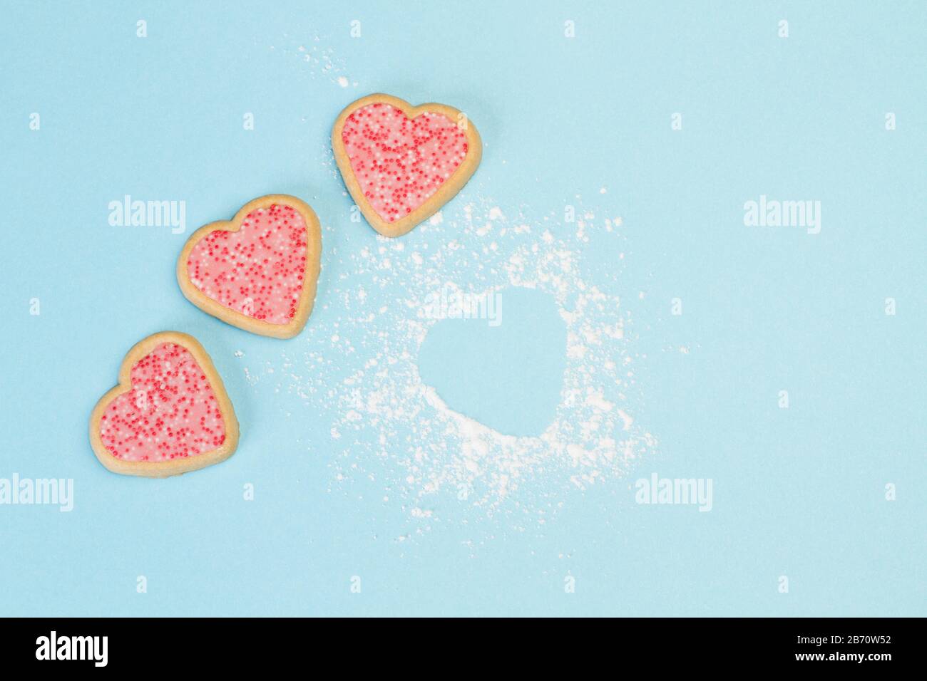 Heart shape cookies on a light blue background Stock Photo - Alamy