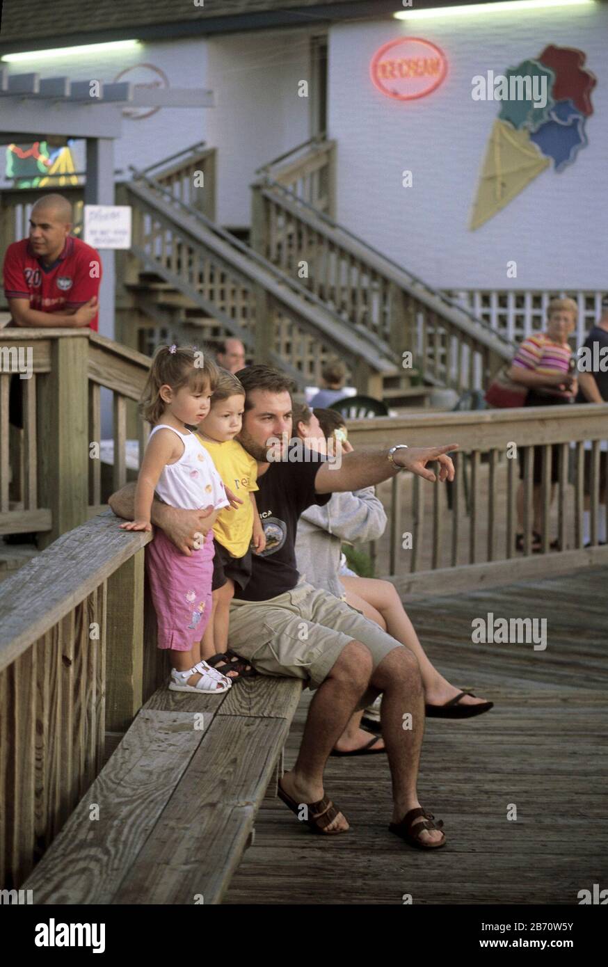 Corpus Christi Texas USA, August 2002: Father and children sitting ...