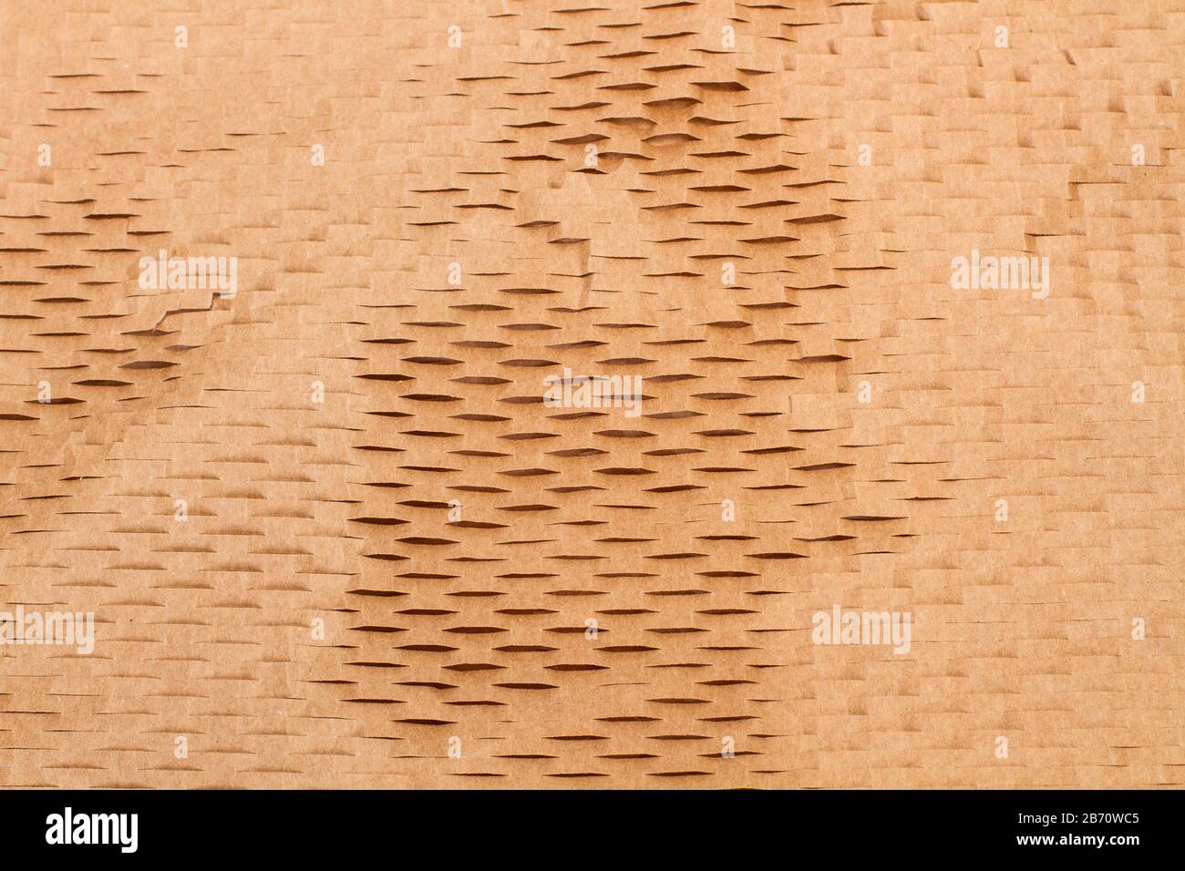 A perforated paper texture in a close up view Stock Photo - Alamy