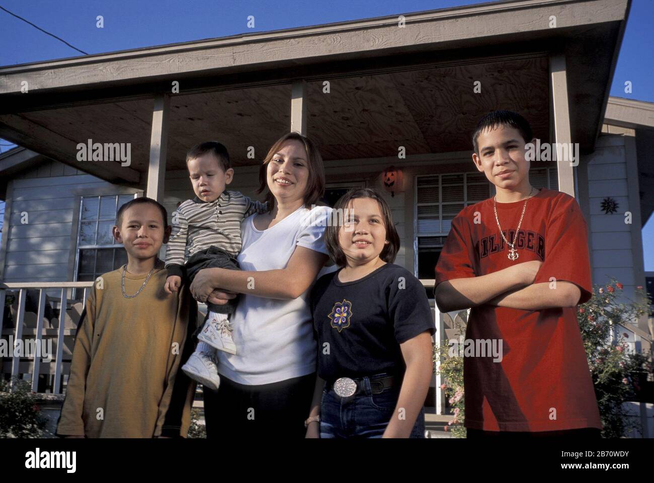 San Juan Texas USA, October 2002: Low-income family in front of home ...