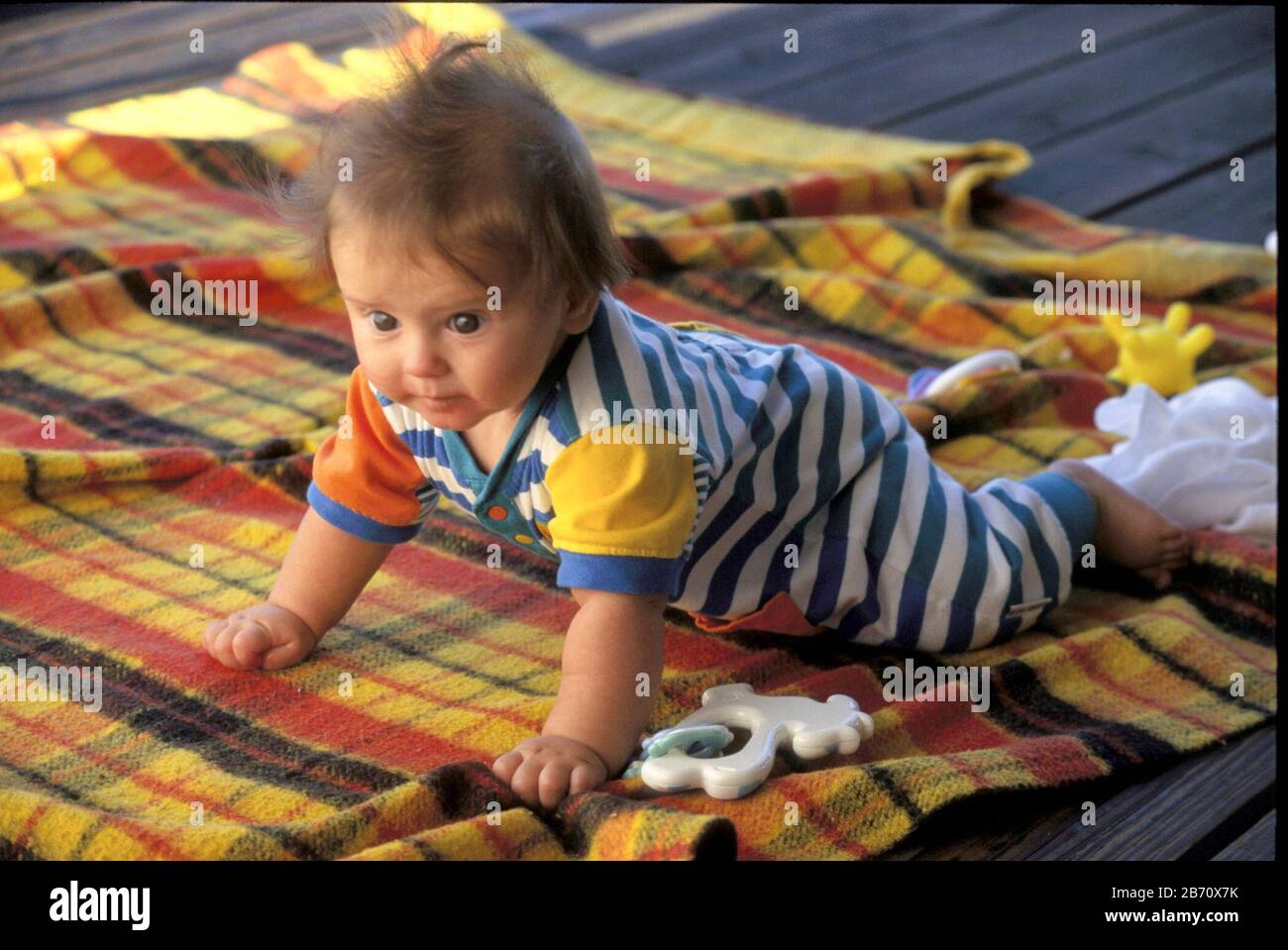 Austin, Texas USA, 1994: Five-month-old baby boy practices pushing his ...