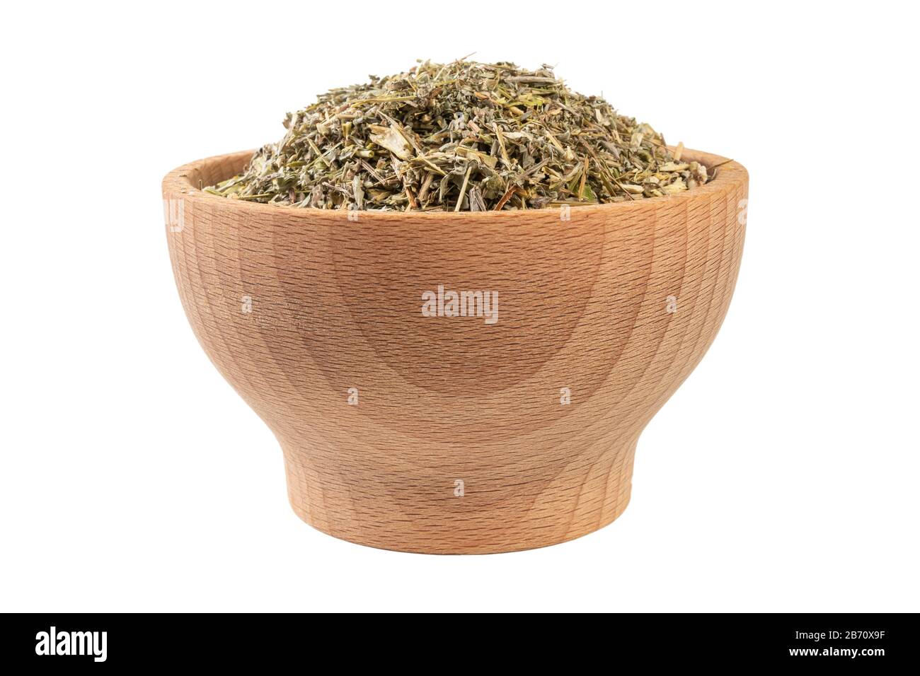 wormwood herb or in latin Absinthii herba herb in wooden bowl isolated ...