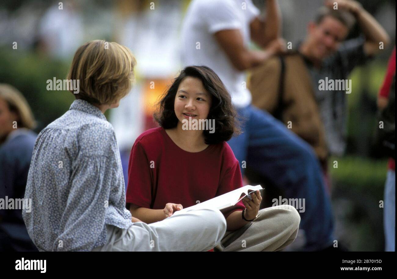 Austin Texas USA: Asian-American student and friend talking on ...