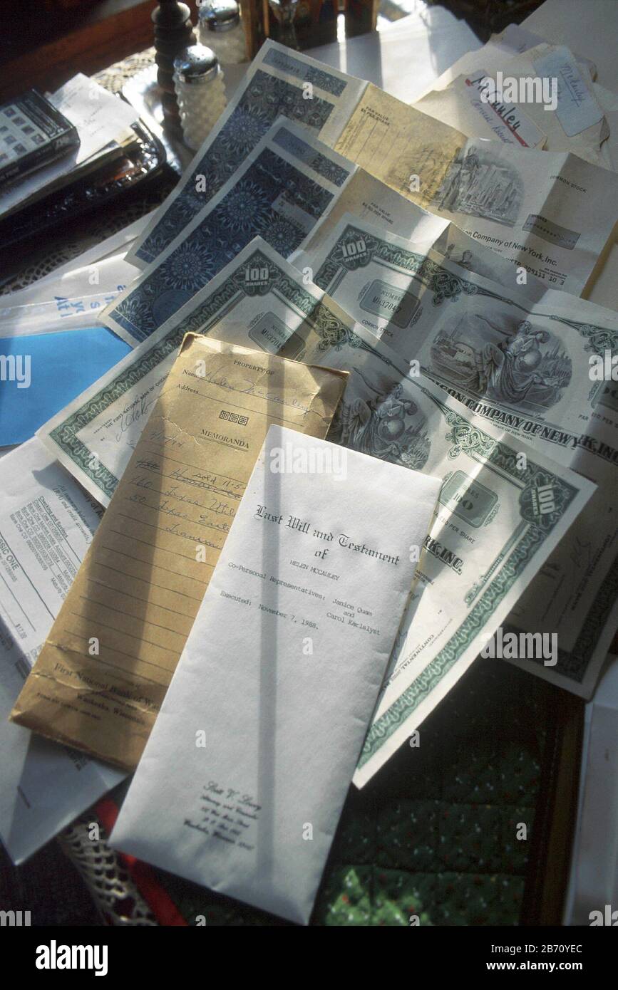 Economy & banking; display of stock certificates on dining table ©Bob ...
