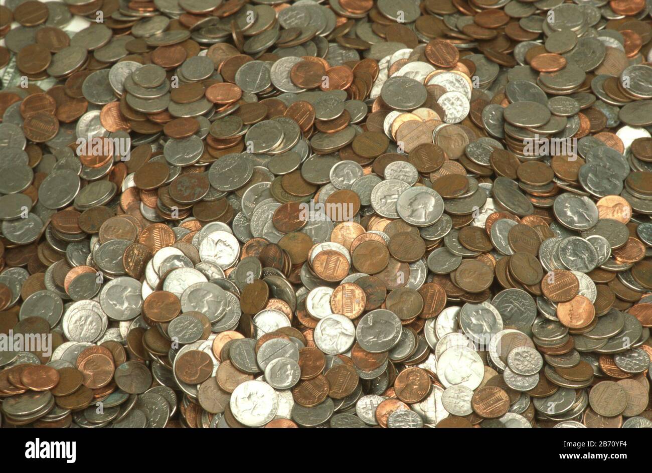 Large pile of various American coins. ©Bob Daemmrich Stock Photo - Alamy