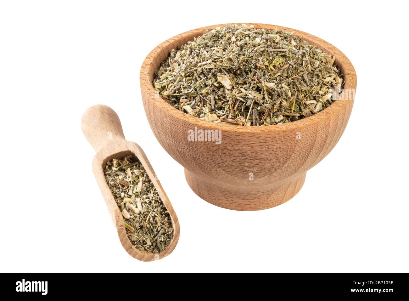 wormwood herb or in latin Absinthii herba herb in wooden bowl and scoop ...
