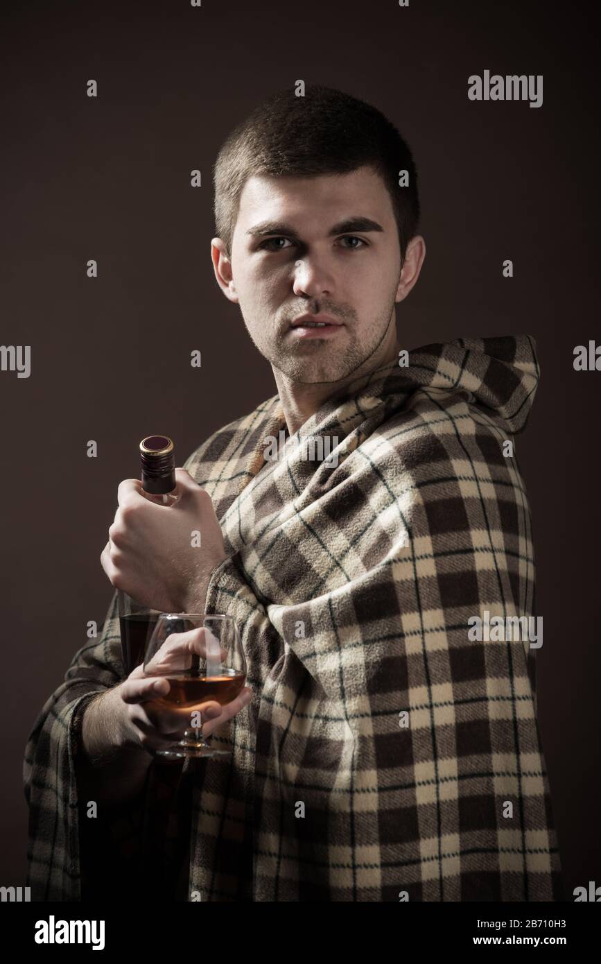 Man wrapped in blanket drinking hi-res stock photography and images - Alamy