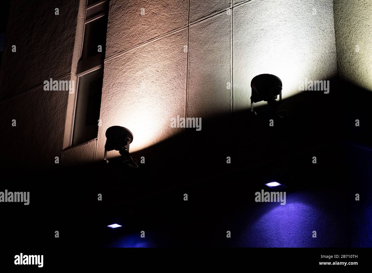 Illumination at night on wall of building Stock Photo - Alamy