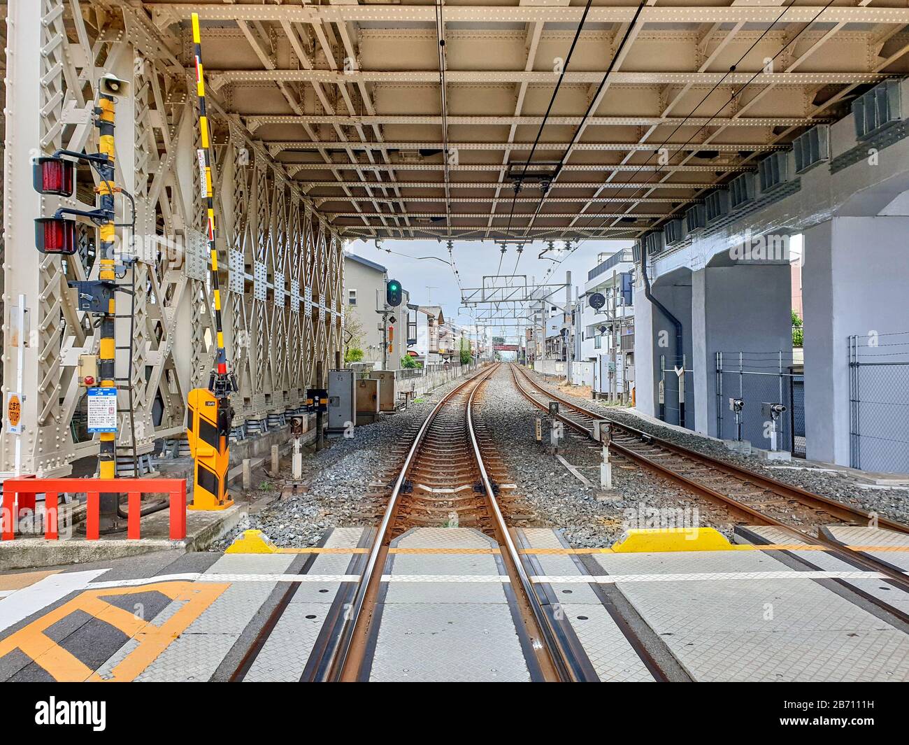 Railway tracks under the bridge Stock Photo - Alamy