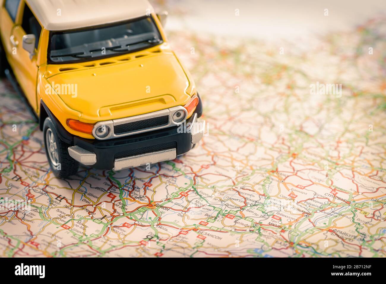 The SUV model is on the road map. Travel concept Stock Photo - Alamy