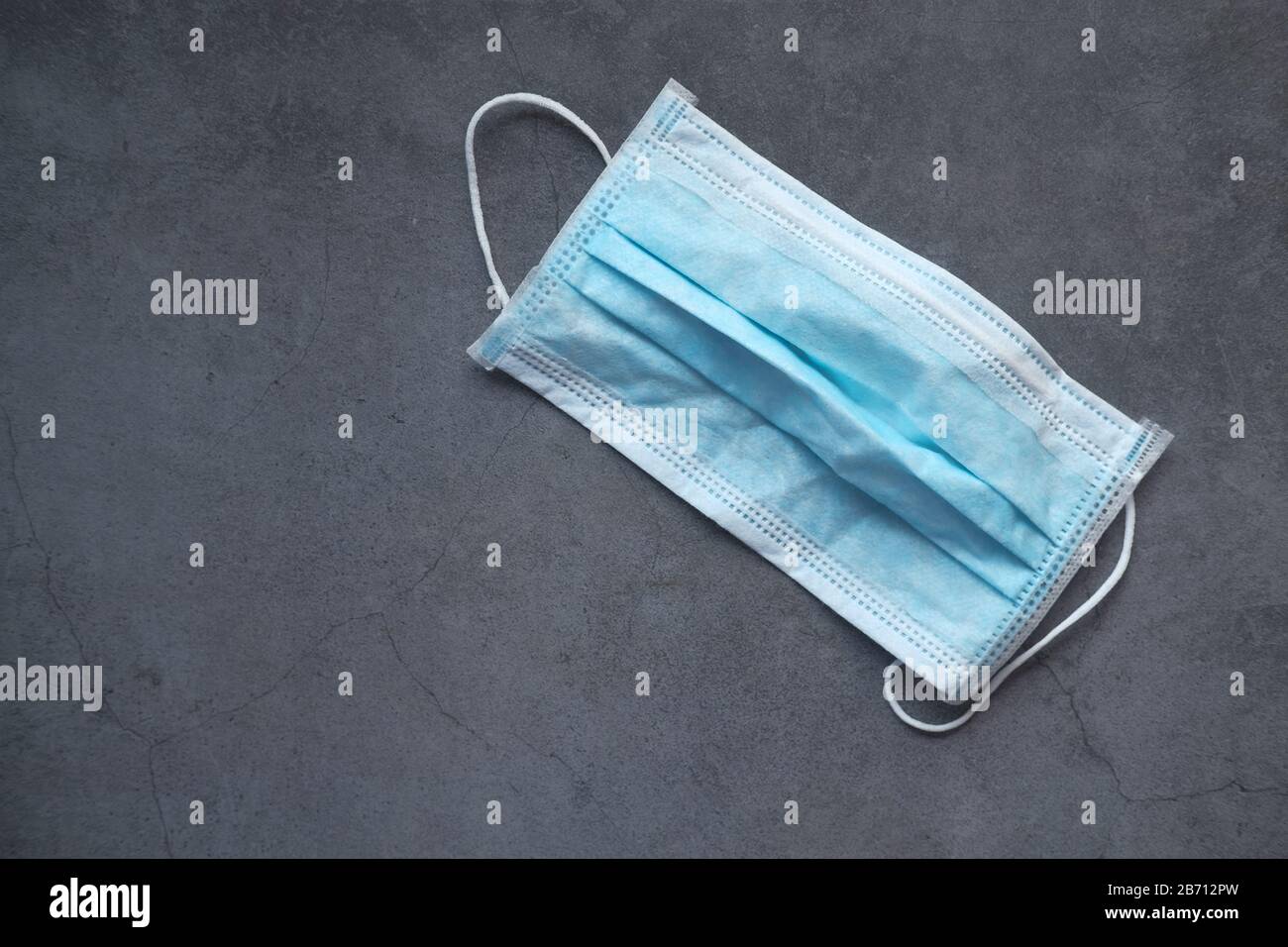 top view of face mask on black background with copy space Stock Photo ...