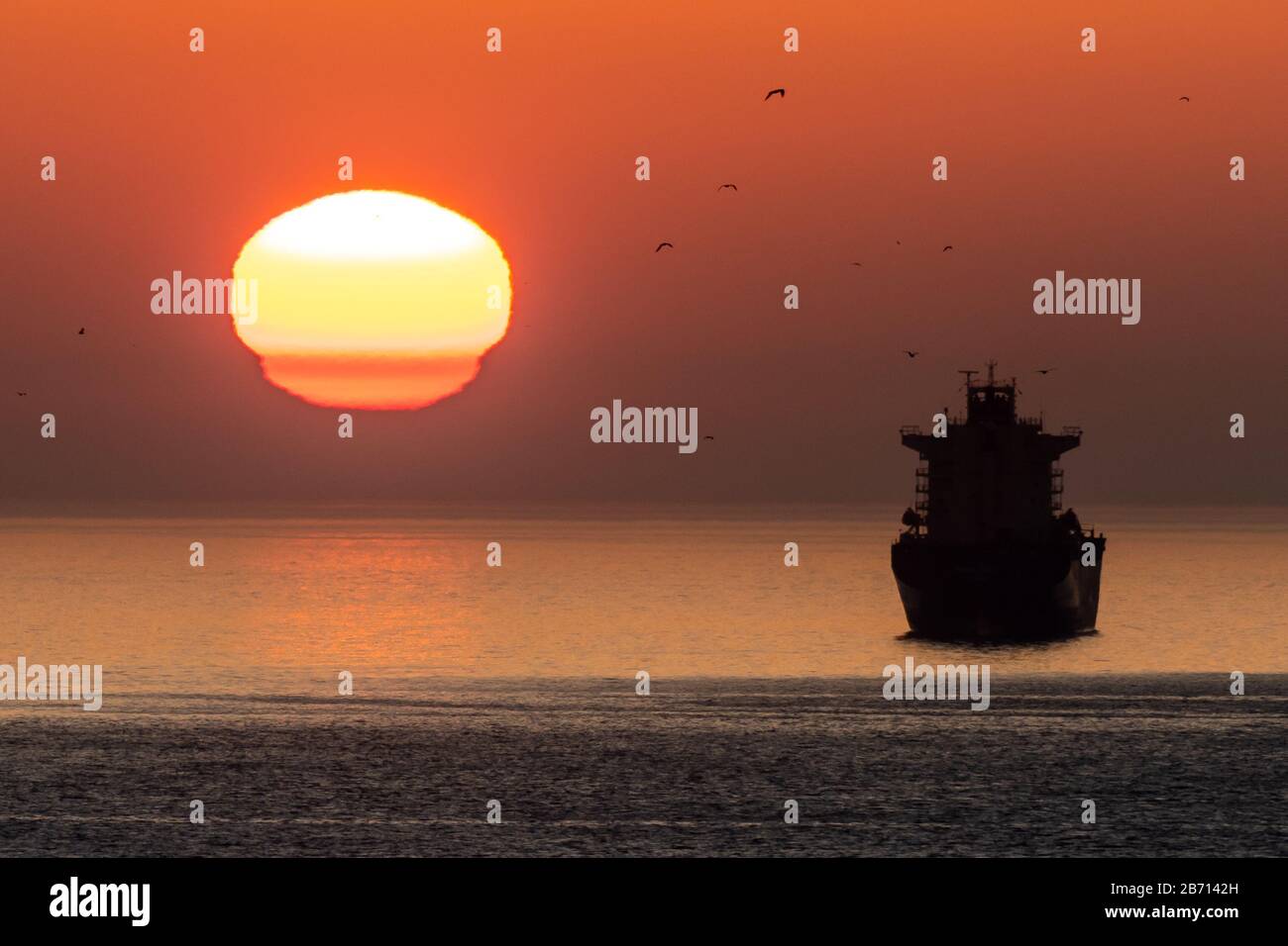 Sun rises over ship hi-res stock photography and images - Alamy