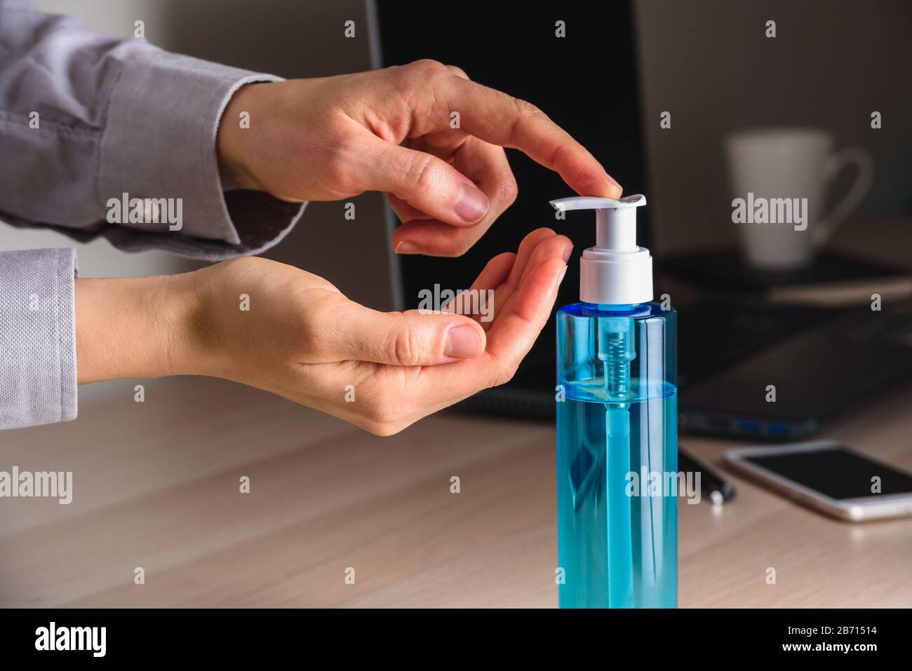 Using Hand sanitizer on working place. personal hygiene concept Stock ...