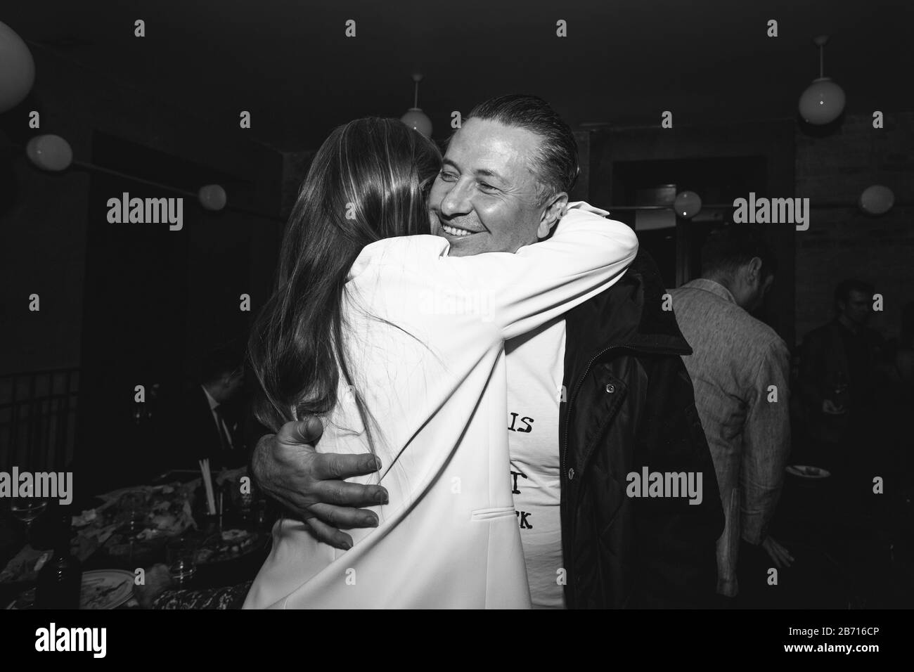 Happy people hugging, haven't seen each other for a long time. Warm and ...