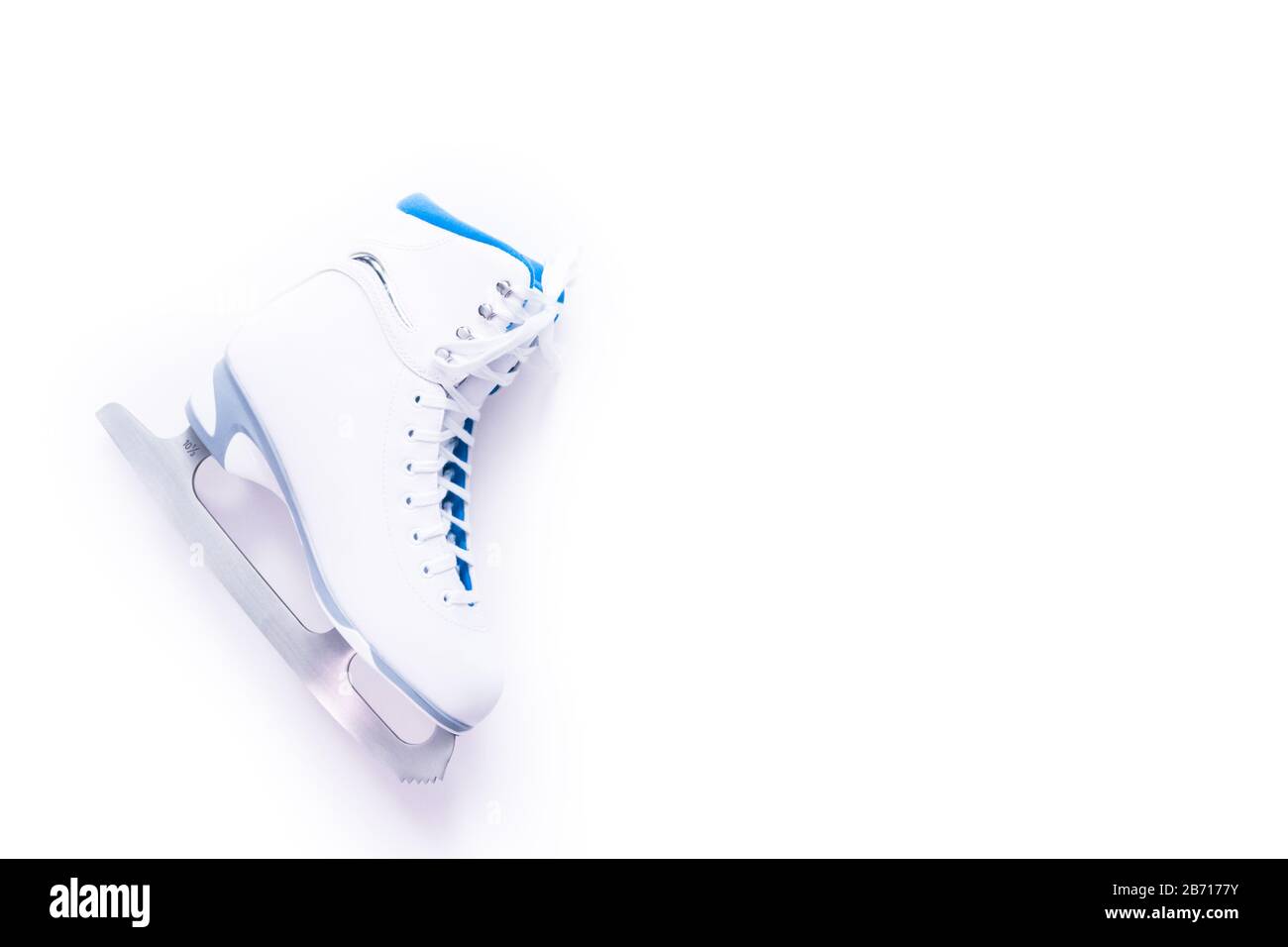 Flat lay. New white figure skates on a white background Stock Photo - Alamy