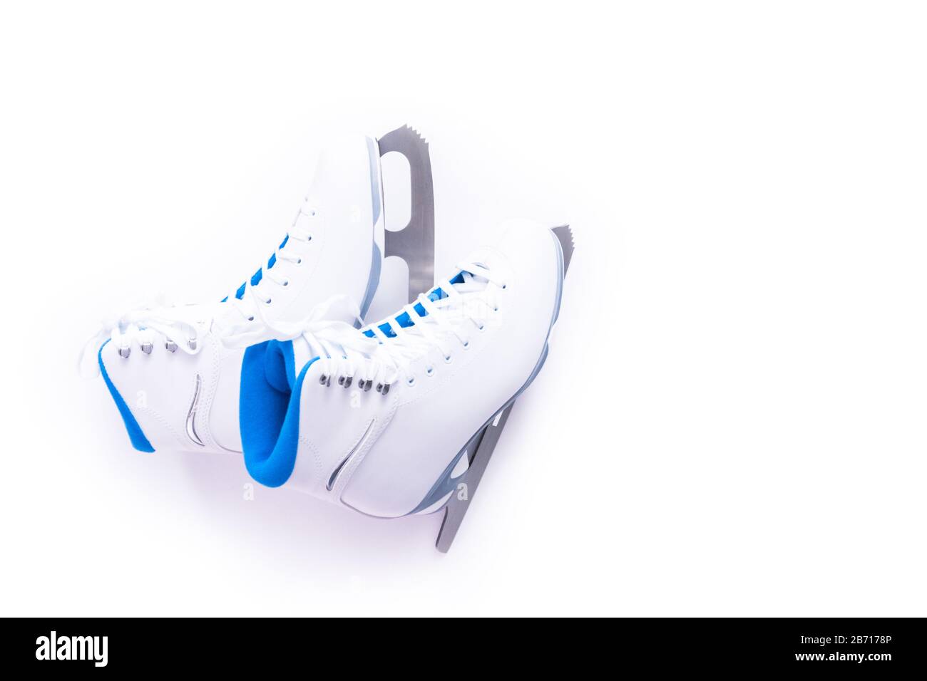 Flat lay. New white figure skates on a white background Stock Photo - Alamy