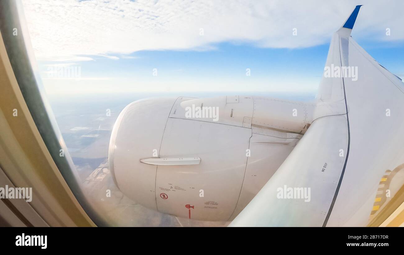 View from the window seat of commercial passenger airplane Stock Photo ...