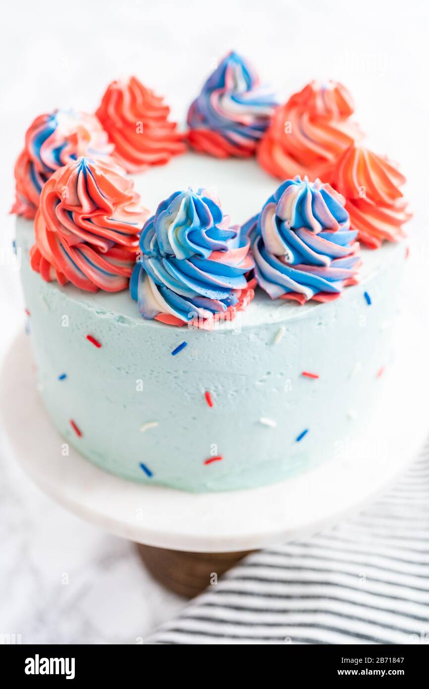 Red, white, and blue round vanilla cake with buttercream frosting for ...