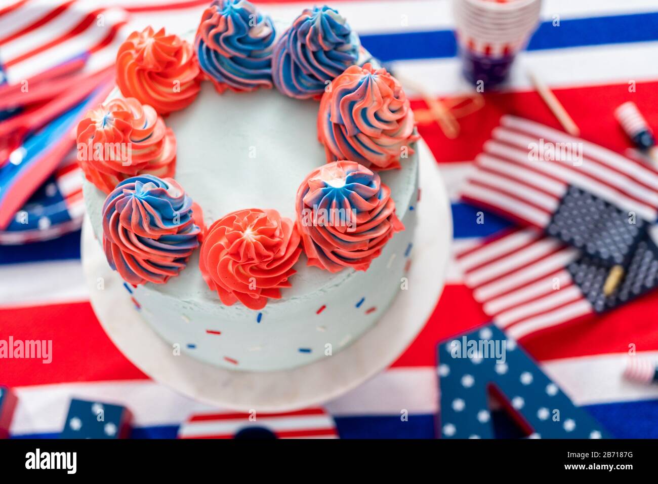 Red, white, and blue round vanilla cake with buttercream frosting for ...