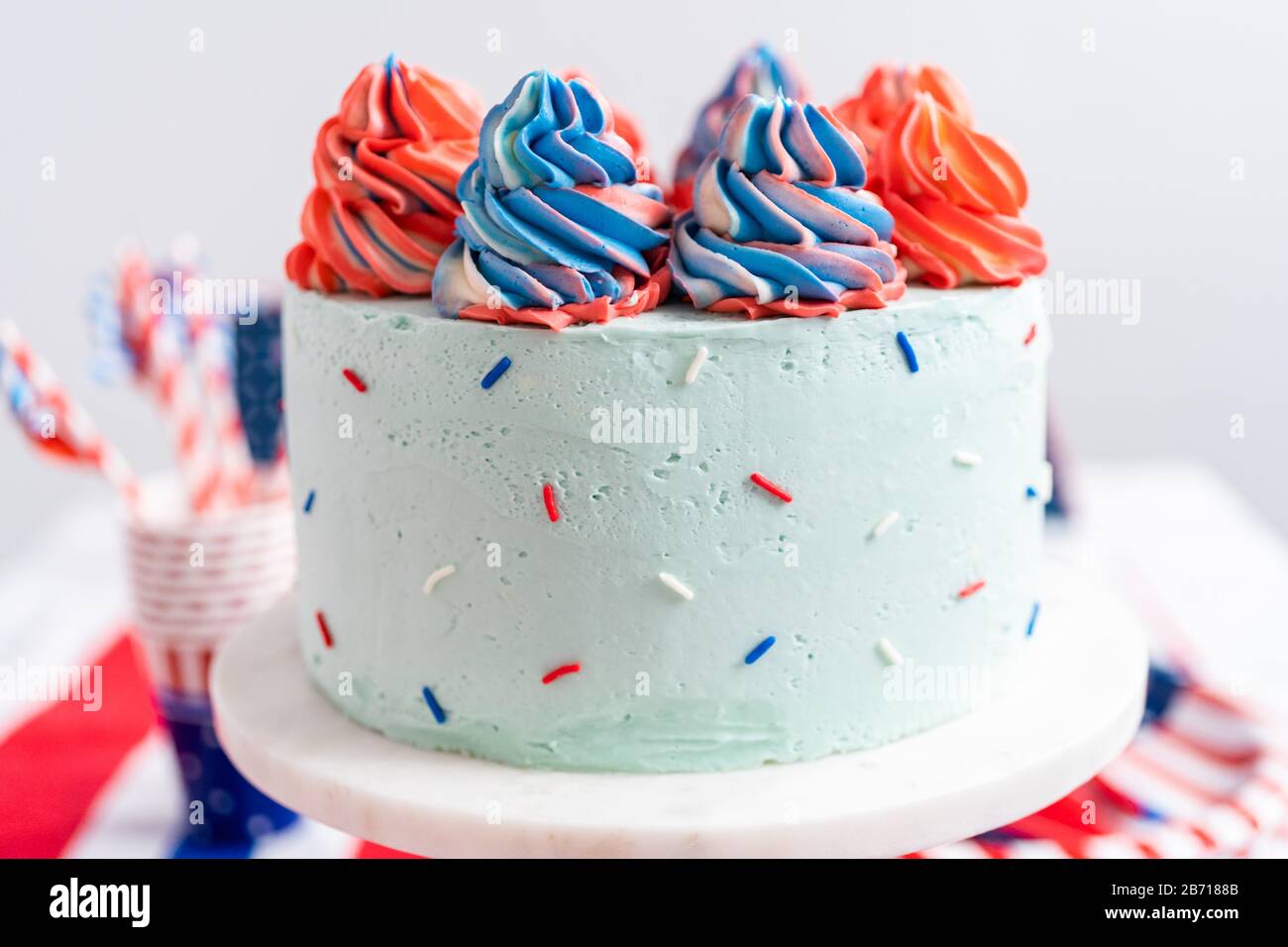 Red, white, and blue round vanilla cake with buttercream frosting for ...