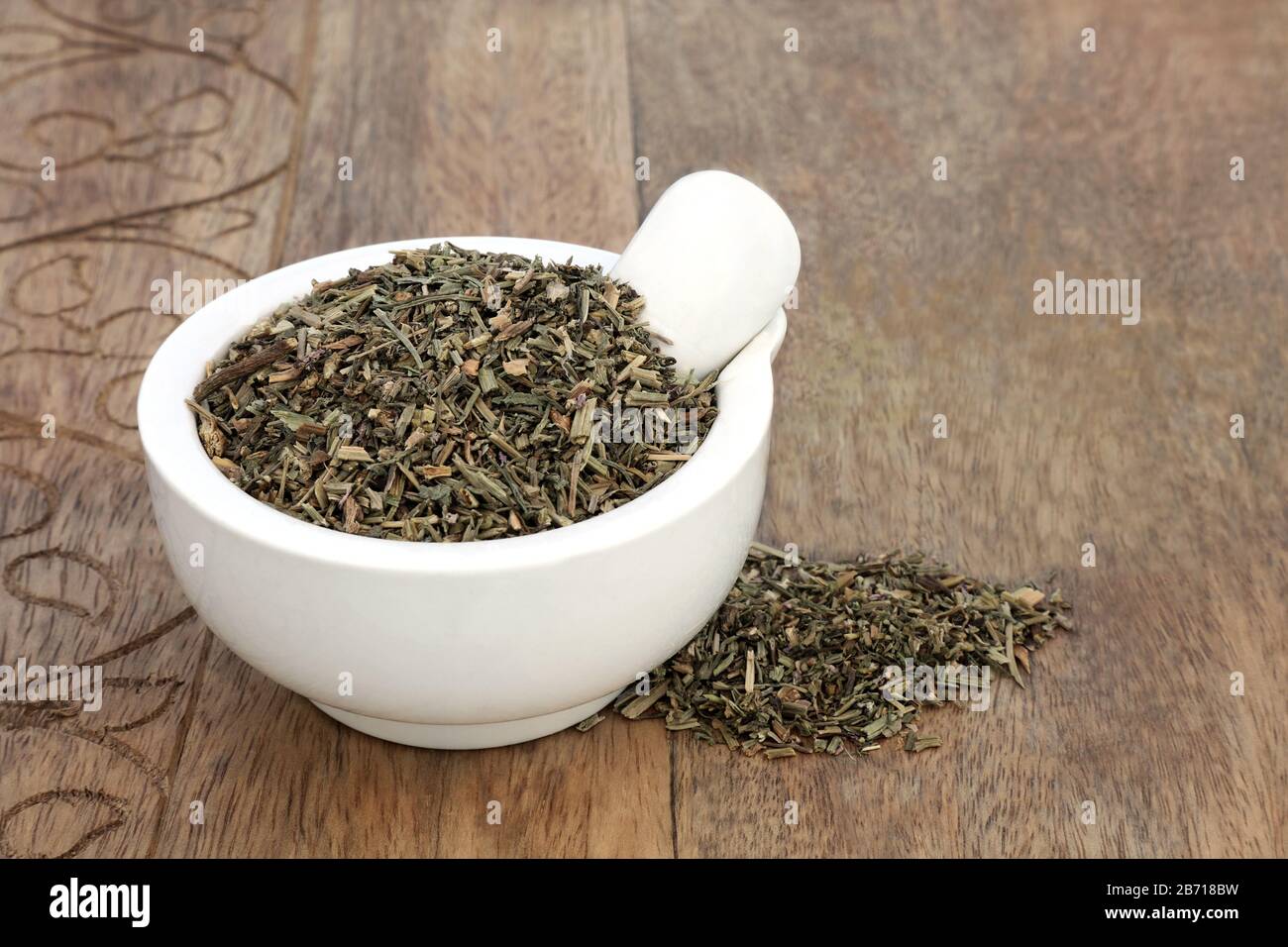 Fumitory herb leaf in a mortar with pestle used in herbal medicine to ...