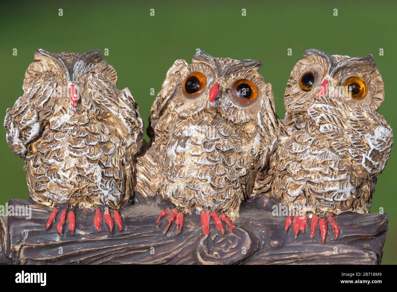 Close up of an ornament of three owls depicting the proverb see no evil ...