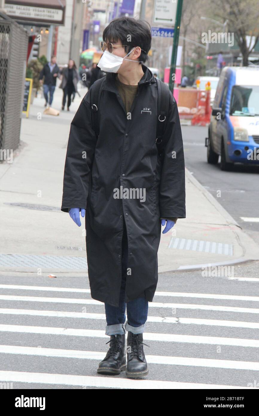 New York, NY, USA. 12th Mar, 2020. Pedestrian seen walking wearing a ...